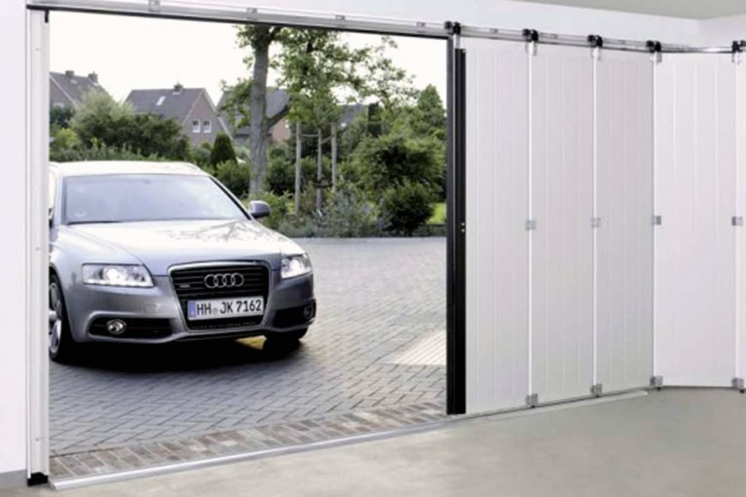 Comment installer une porte de garage COULISSANTE : Guide de pose complet